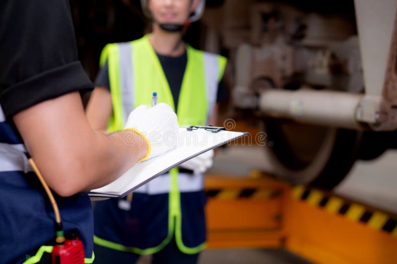 Closeup Hands Engineer Man and Woman or Worker Checking Electric Train ...