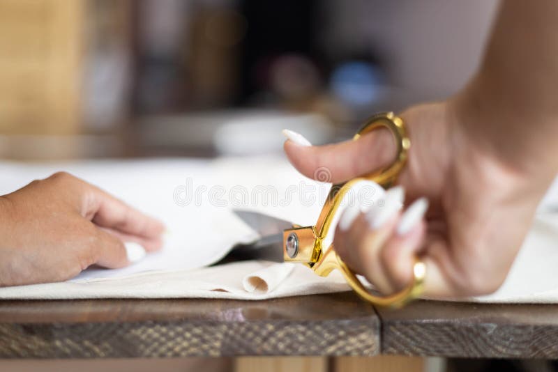 Closeup Hands of Female Professional Seamstress Cutting Textile Use ...