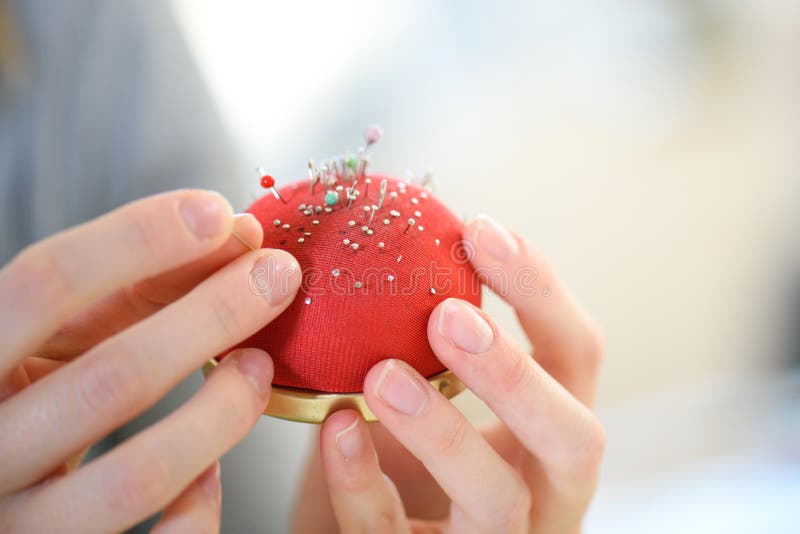 Closeup Hands Holding Pin Cushion Stock Photo - Image of adult ...