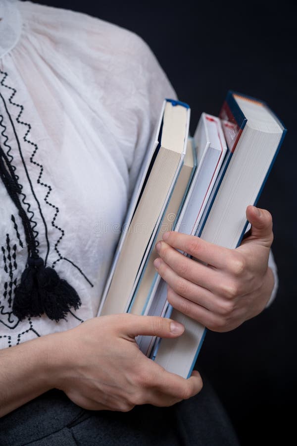 Closeup of Hands Holding a Stack of Books. Concept of Self-development ...