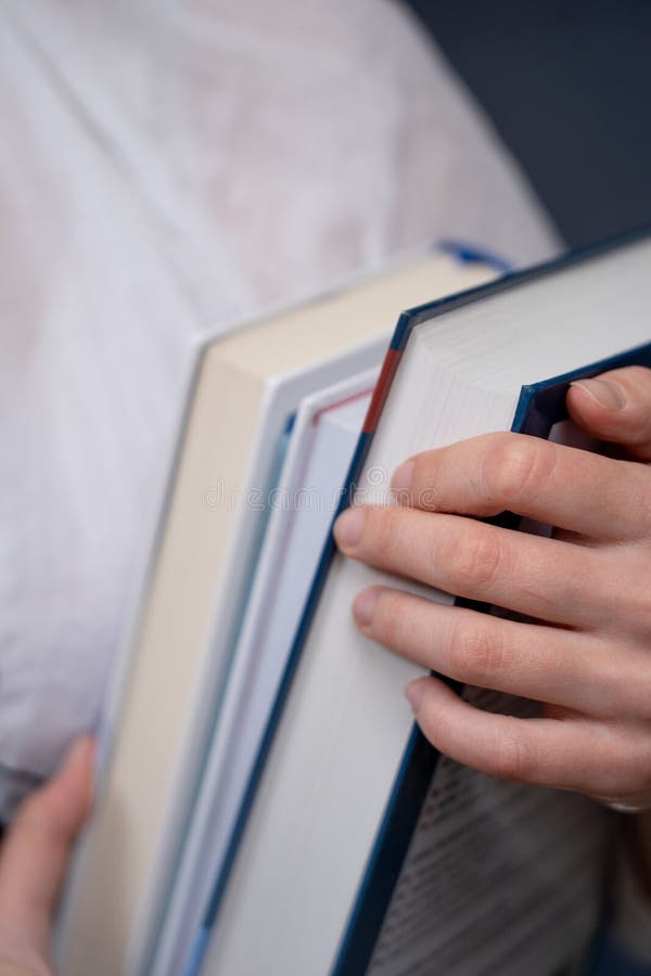 Closeup of Hands Holding a Stack of Books. Concept of Self-education ...