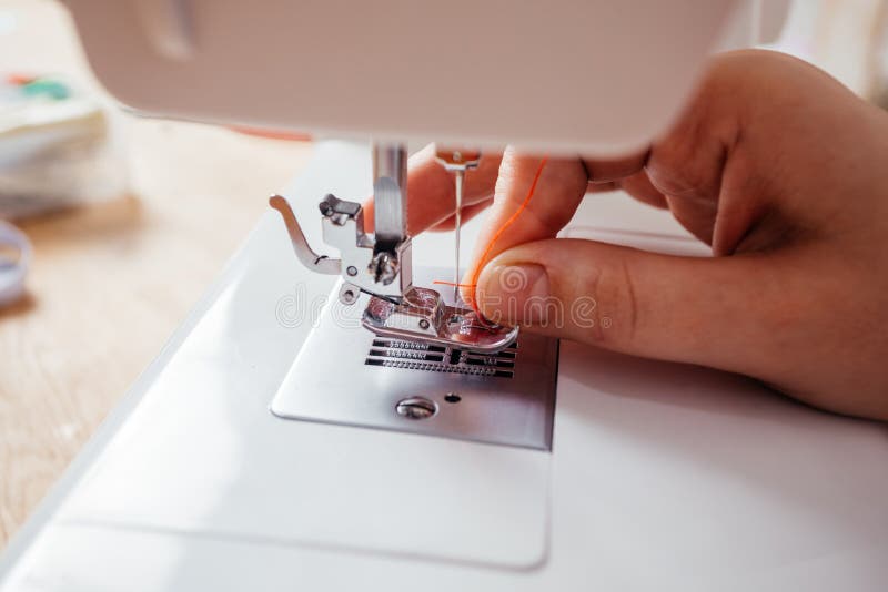 Closeup Hands Inserting Thread into Sewing Machine Needle Stock Photo ...