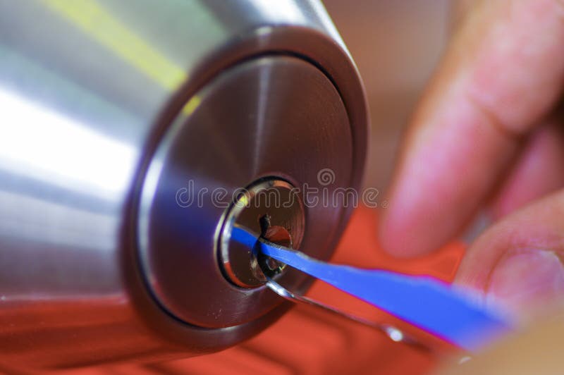 Closeup Hands of Locksmith Using Metal Pick Tools To Open Locked Door ...