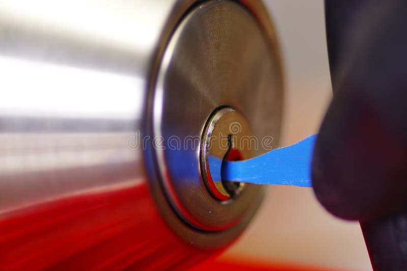 Closeup Hands of Locksmith Using Metal Pick Tools To Open Locked Door ...