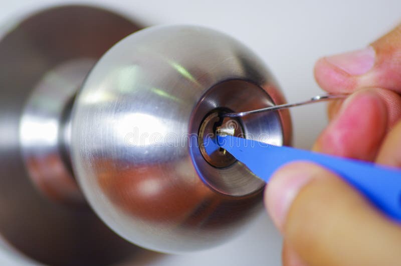 Closeup Hands of Locksmith Using Pick Tools To Open Locked Door Stock ...