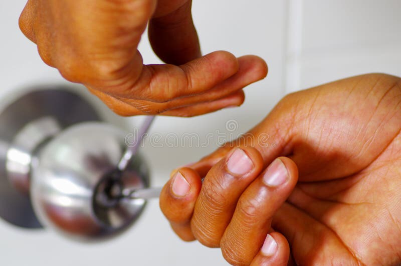 Closeup Hands of Locksmith Using Pick Tools To Open Locked Door Stock ...