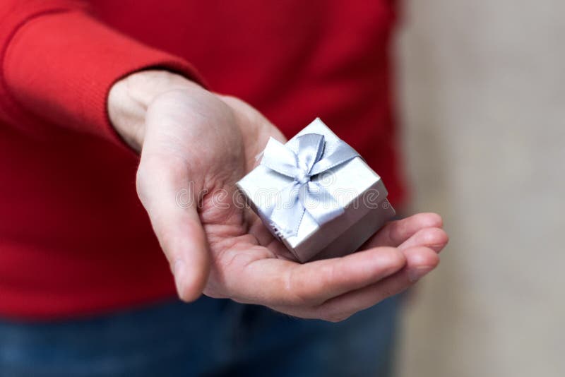 Closeup on Hands Man Giving a Small Gray Gift Box Stock Image - Image ...