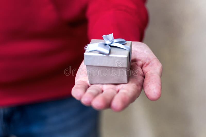 Closeup on Hands Man Giving a Small Gray Gift Box Stock Photo - Image ...