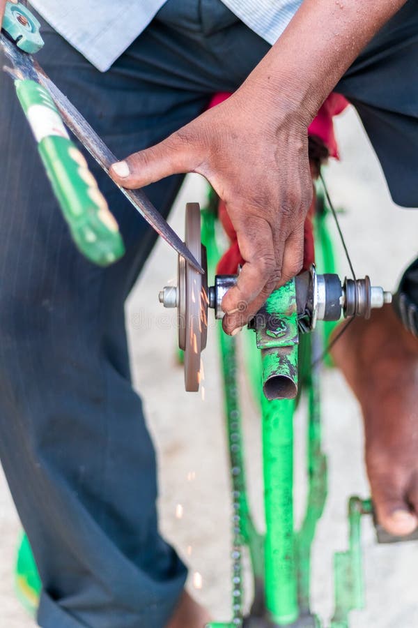 Closeup Hands of a Man Sharpening a Knife on a DIY Makeshift Sharpening ...