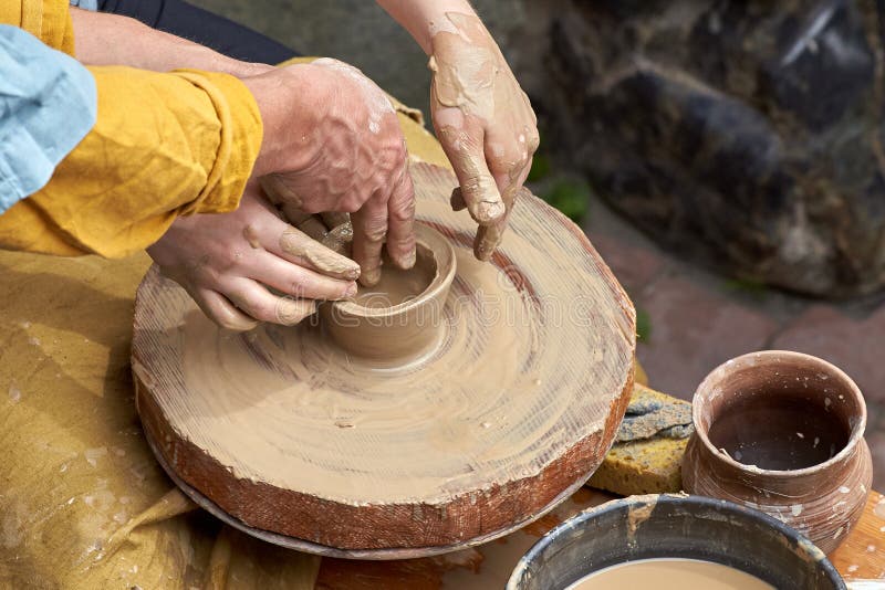 Closeup of the Hands of a Potter and Apprentice Stock Photo - Image of ...
