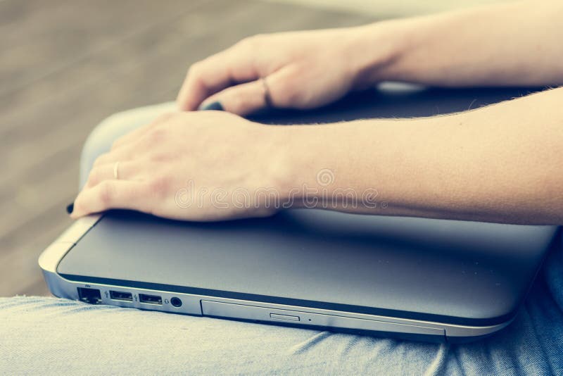 Closeup of Hands Resting on Closed Laptop. Stock Image - Image of ...