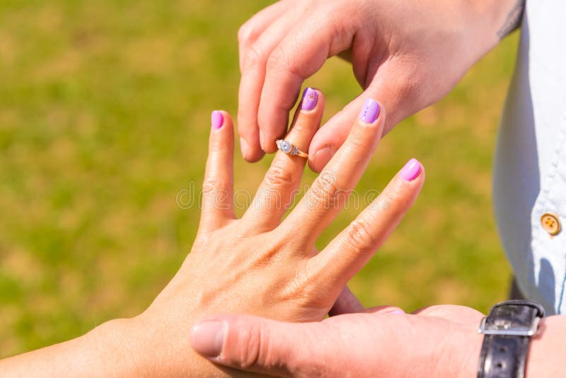 Closeup of Hands of Two Unknown People in a Marriage Proposal with ...