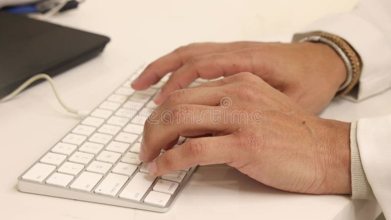 Closeup of Hands Typing on White Compact Keyboard during Office Work ...