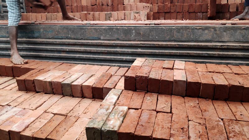 Unloading Bricks at a Construction Site Using a Crane and Workers ...