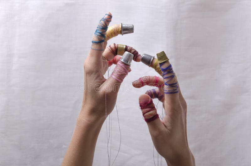 Closeup of Hands, Winding Threads, Thimbles Against of White Fabric ...