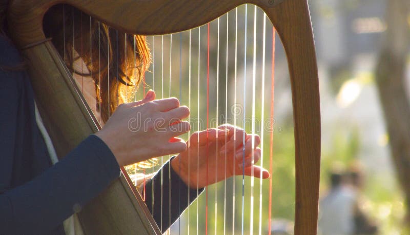 Closeup of the Hands of a Woman Playing Harp in the Park Stock Photo ...