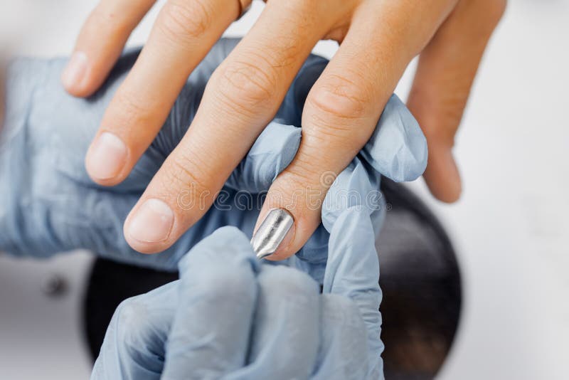 Closeup Hands of Young Man Gets Professional Manicure in Spa Salon ...