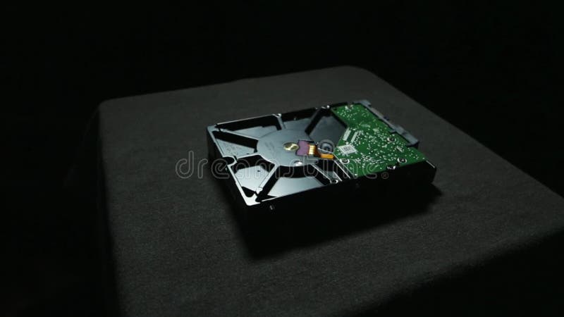 Closeup of HDD Underside in Dark Room on Gray Textile Surface. Hard ...