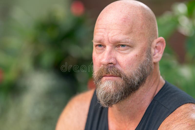 Closeup Head Shot of a Handsome Bald Man with Beard Looking Away from ...