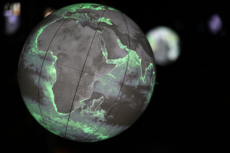 Closeup of an Illuminated Earth Model on Black Background Stock Photo ...