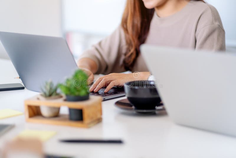 Businessman Using and Working on Laptop Computer Together in Office ...