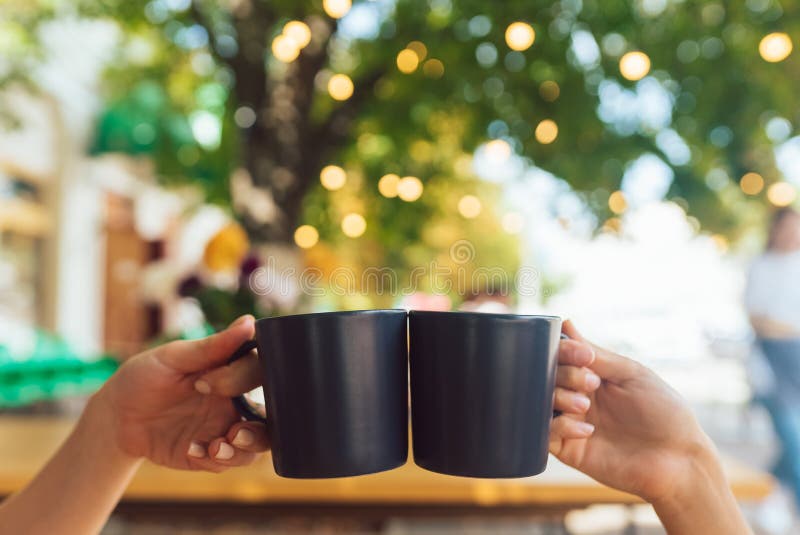 Closeup Image of a People Clinking Coffee Cups Together in Cafe Stock ...