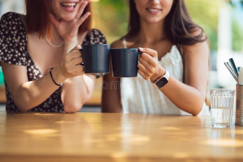 Closeup Image of a People Clinking Coffee Cups Together in Cafe Stock ...