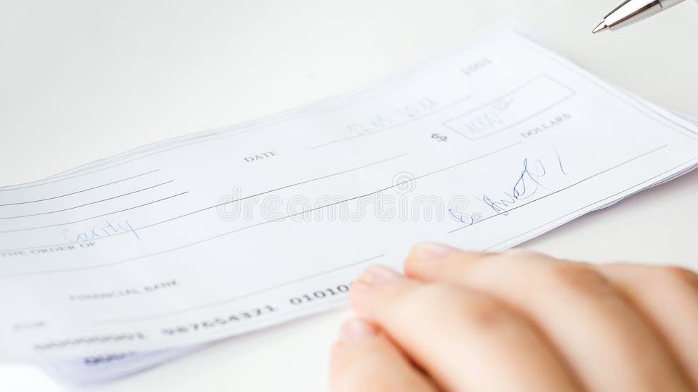 Closeup Image of Filled and Signed Banking Cheque Stock Image - Image ...