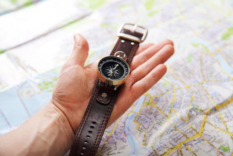 Closeup of Hand with Magnetic Compass Over a Map Stock Photo - Image of ...