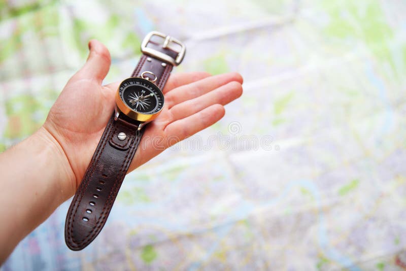 Closeup Image of Hand with Magnetic Compass Over a Map Stock Image ...