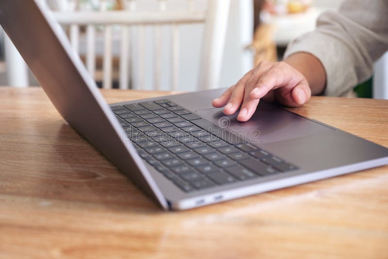 Hand Using and Touching on Laptop Touchpad on Wooden Table Stock Image ...