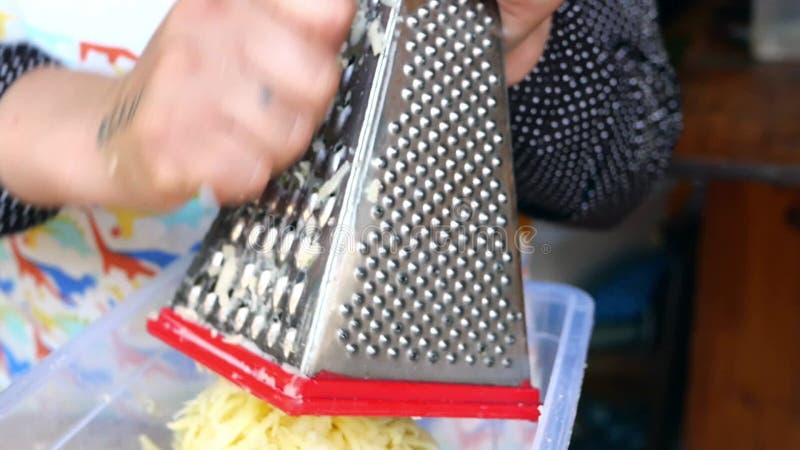 Grating Cheese by Hand in the Kitchen Can Be Considered an Artisanal ...