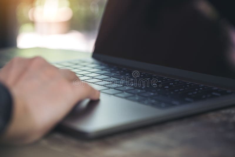Hands Working and Typing on Laptop Keyboard with Blur Background Stock ...