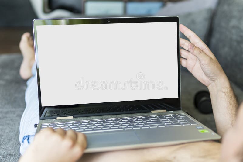 Closeup Image of Man Lying on Bed Working on Laptop Computer. POV Shot ... Closeup Image of Man Lying on Bed Working on Laptop Computer. POV Shot ...