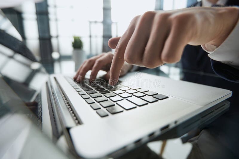 Young Man Presses His Finger on the Computer at the Table in the Office ...