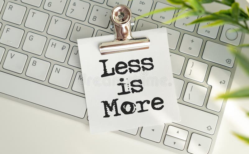 Closeup Image of Note Paper with Text less is MORE and Keyboard. Stock ...