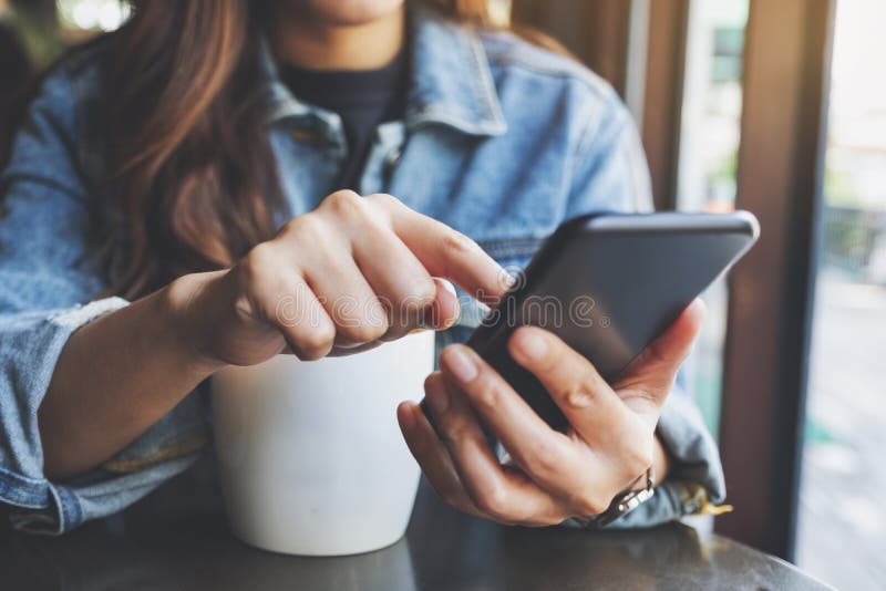 A Woman Holding and Touching on Mobile Phone Screen Stock Image - Image ...