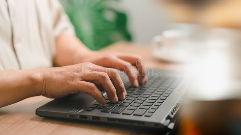 Closeup Image of a Young Man Working and Typing on Laptop Computer ...