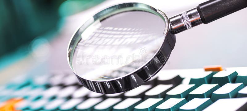Closeup Images of Magnifying Glass on Laptop Keyboard Stock Photo ...