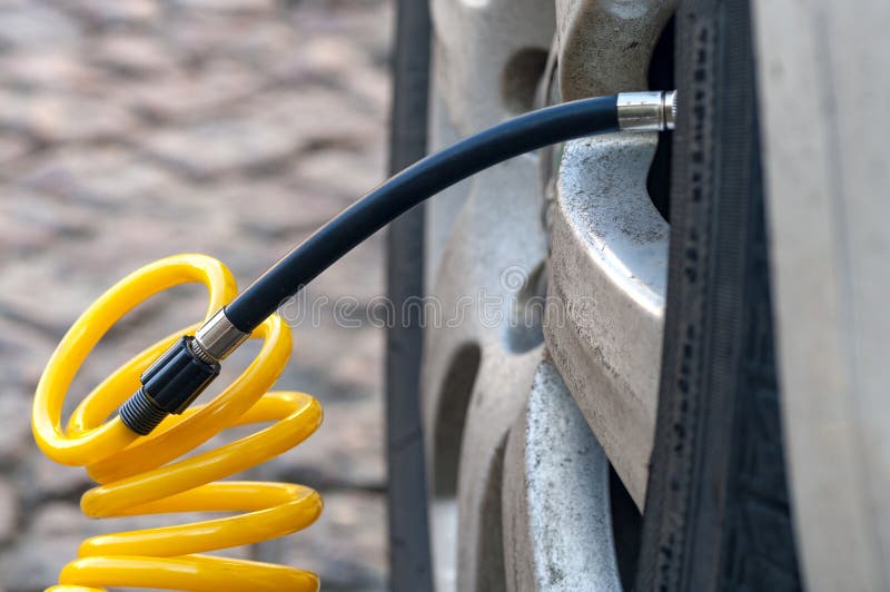 Closeup of Inflating Car Tyre with Electric Pump Stock Image - Image of ...