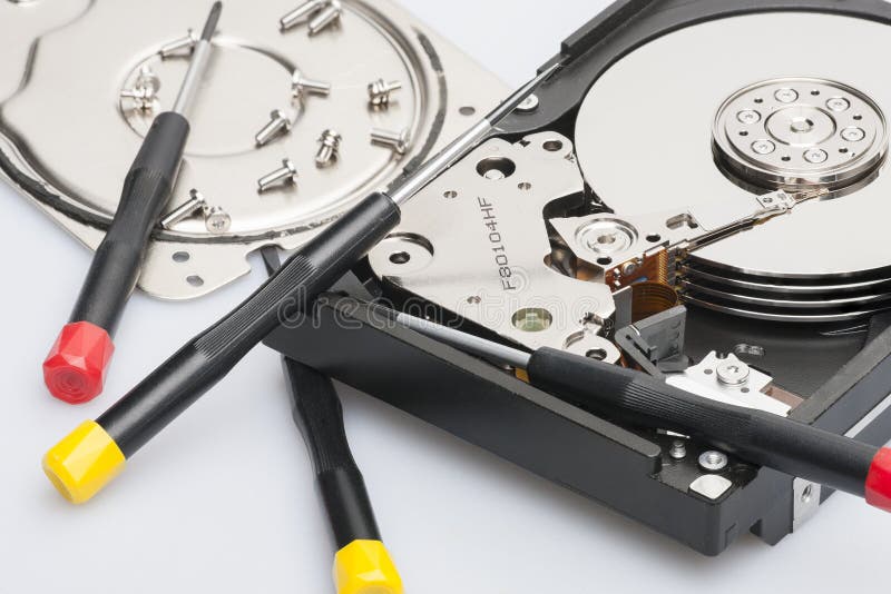 Closeup Inside a Hard Drive with an Overlaying Image of an Electronic ...