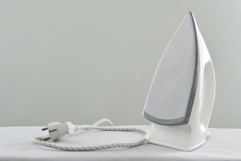 Iron is an Electrical Appliance for Homework. Ironing of Textile ...