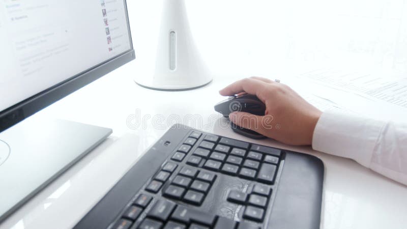 Closeup 4k Video of Female Hand Using Computer Mouse and Scrolling ...