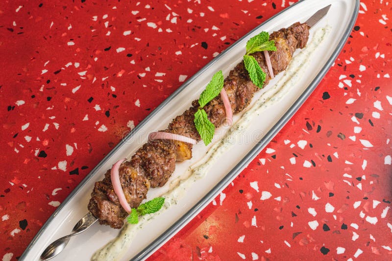 Closeup of a Kebab on a Red Marble Background Stock Image - Image of ...