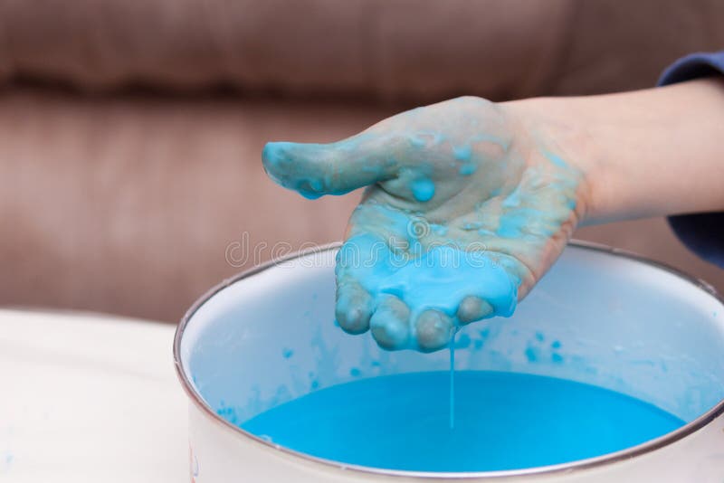 Closeup of Kids Hand Holding Blue Substance, Cornstarch and Water ...