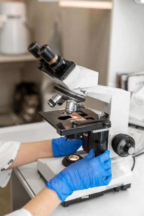 Closeup Microscope Lens on Gray Background in Laboratory Stock Photo ...
