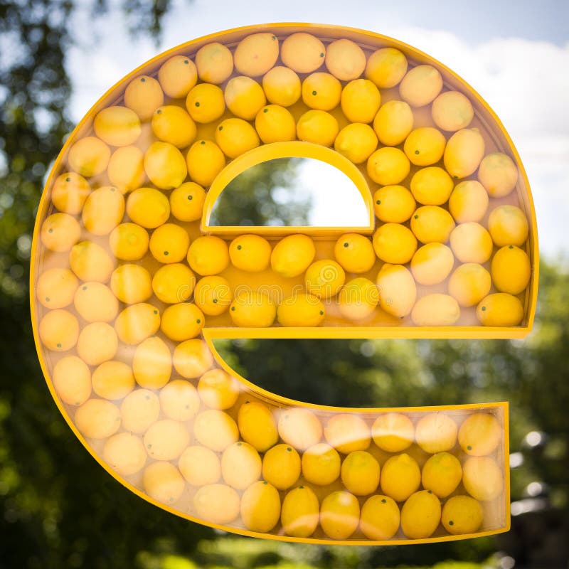 Closeup of a Large Letter E with Bunch of Lemons. Vitamin C in Every ...