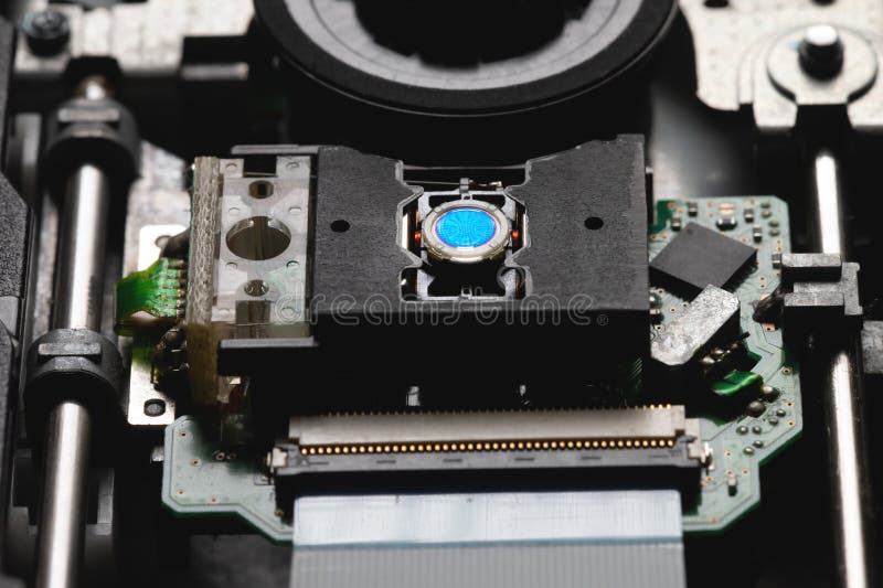 Closeup of a Laser Head and Dvd Rom Drive with Boards. Writing and ...