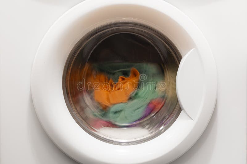 Closeup of Laundry Spinning in Washing Machine Stock Photo - Image of ...