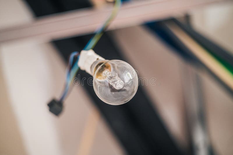 Closeup of the Light Bulb Hanging from the Ceiling. Stock Photo - Image ...